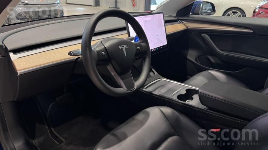 Blue Tesla Model 3 2021 in Riga, with an engine capacity of 0.00 L and mileage of 124 thousand km for 26990 €, photo 10 on AUTOMOTO.COM.LV
