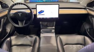 Blue Tesla Model 3 2021 in Riga, with an engine capacity of 0.00 L and mileage of 124 thousand km for 26990 €, photo 11 on AUTOMOTO.COM.LV