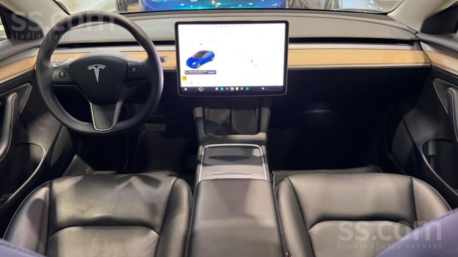 Blue Tesla Model 3 2021 in Riga, with an engine capacity of 0.00 L and mileage of 124 thousand km for 26990 €, photo 11 on AUTOMOTO.COM.LV