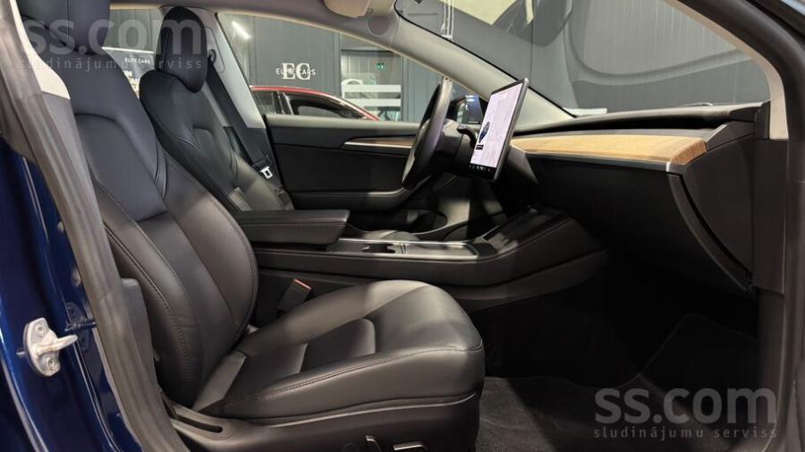 Blue Tesla Model 3 2021 in Riga, with an engine capacity of 0.00 L and mileage of 124 thousand km for 26990 €, photo 15 on AUTOMOTO.COM.LV