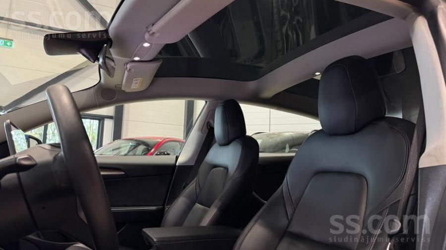 Blue Tesla Model 3 2021 in Riga, with an engine capacity of 0.00 L and mileage of 124 thousand km for 26990 €, photo 17 on AUTOMOTO.COM.LV