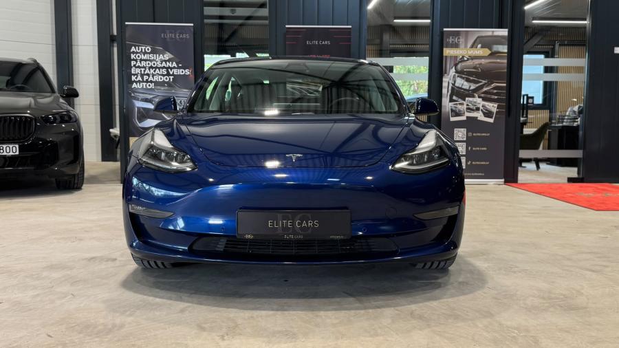 Blue Tesla Model 3 2021 in Riga, with an engine capacity of 0.00 L and mileage of 124 thousand km for 26990 €, photo 3 on AUTOMOTO.COM.LV