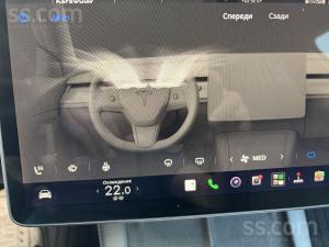 Grey Tesla Model 3 2022 in Riga, with an engine capacity of 0.00 L and mileage of 124 thousand km for 27300 €, photo 13 on AUTOMOTO.COM.LV