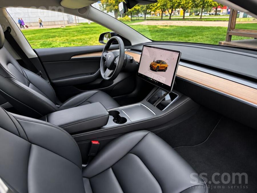 Grey Tesla Model 3 2023 in Riga, with an engine capacity of 0.00 L and mileage of 73 thousand km for 27600 €, photo 12 on AUTOMOTO.COM.LV