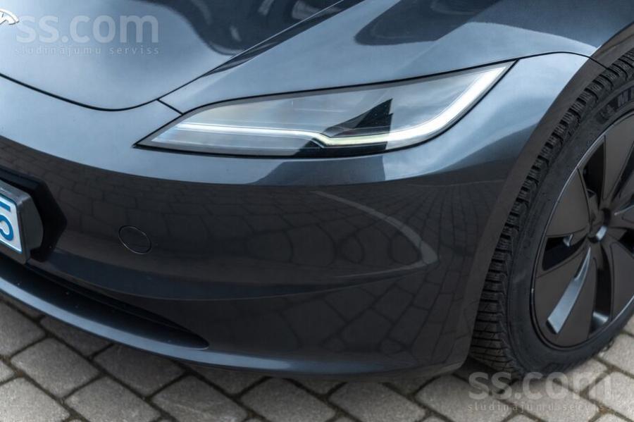 Grey Tesla Model 3 2024 in Riga, with an engine capacity of 0.00 L and mileage of 103 thousand km for 37900 €, photo 12 on AUTOMOTO.COM.LV