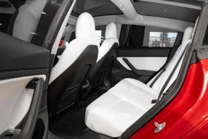 Red Tesla Model 3 2019 in Riga, with an engine capacity of 0.00 L and mileage of 140 thousand km for 23900 €, photo 13 on AUTOMOTO.COM.LV