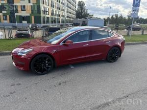 Red Tesla Model 3 2019 in Riga, with an engine capacity of 0.00 L and mileage of 173 thousand km for 21000 €, photo 3 on AUTOMOTO.COM.LV