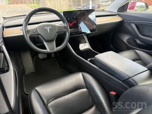Red Tesla Model 3 2019 in Riga, with an engine capacity of 0.00 L and mileage of 173 thousand km for 21000 €, photo 17 on AUTOMOTO.COM.LV