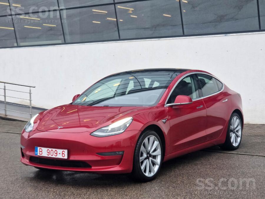 Red Tesla Model 3 2020 in Riga, with an engine capacity of 0.00 L and mileage of 126 thousand km for 21777 €, photo 1 on AUTOMOTO.COM.LV