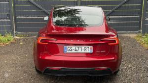 Red Tesla Model 3 2023 in Jonava, with an engine capacity of 0.00 L and mileage of 70 thousand km for 29600 €, photo 11 on AUTOMOTO.COM.LV