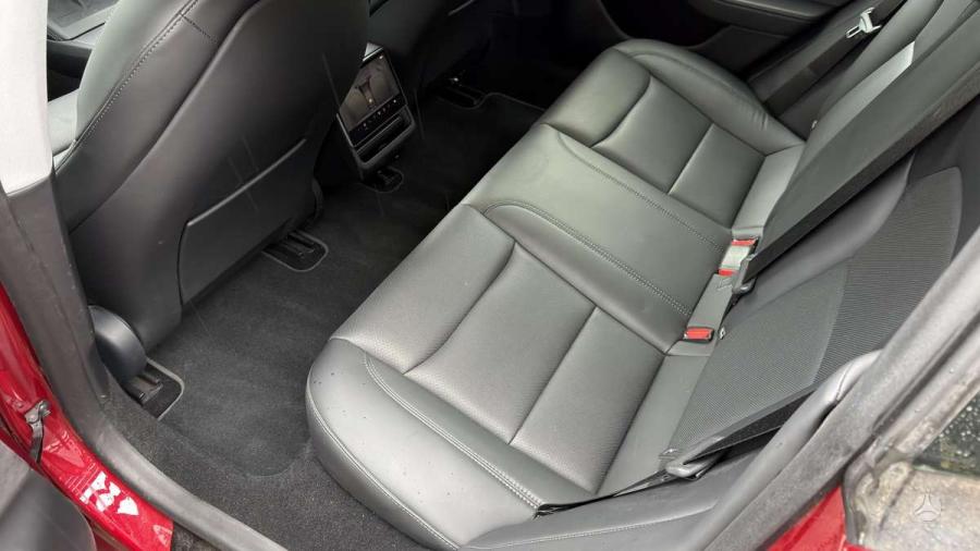 Red Tesla Model 3 2023 in Jonava, with an engine capacity of 0.00 L and mileage of 70 thousand km for 29600 €, photo 21 on AUTOMOTO.COM.LV