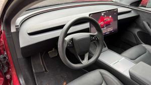 Red Tesla Model 3 2023 in Jonava, with an engine capacity of 0.00 L and mileage of 70 thousand km for 29600 €, photo 22 on AUTOMOTO.COM.LV