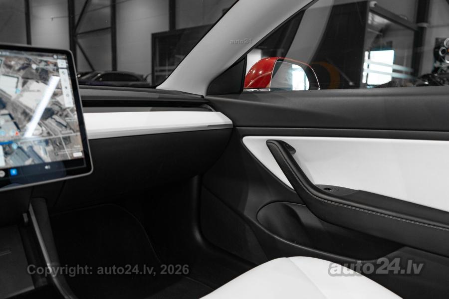 Red Tesla Model 3 2019 in Riga, with an engine capacity of 0.00 L and mileage of 140 thousand km for 23900 €, photo 27 on AUTOMOTO.COM.LV