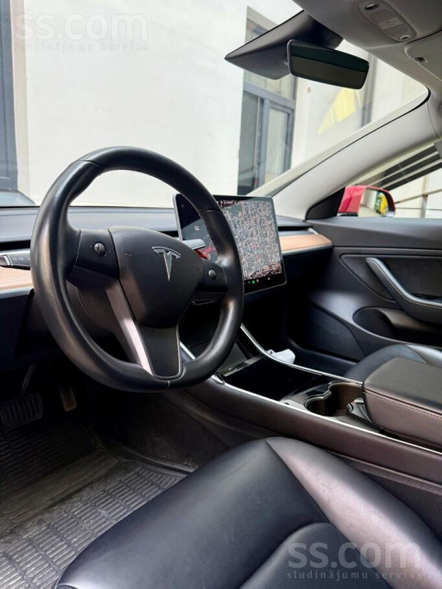 Red Tesla Model 3 2019 in Riga, with an engine capacity of 0.00 L and mileage of 116 thousand km for 20500 €, photo 6 on AUTOMOTO.COM.LV