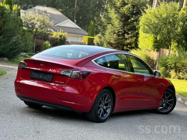 Red Tesla Model 3 2019 in Riga, with an engine capacity of 0.00 L and mileage of 105 thousand km for 18950 €, photo 2 on AUTOMOTO.COM.LV
