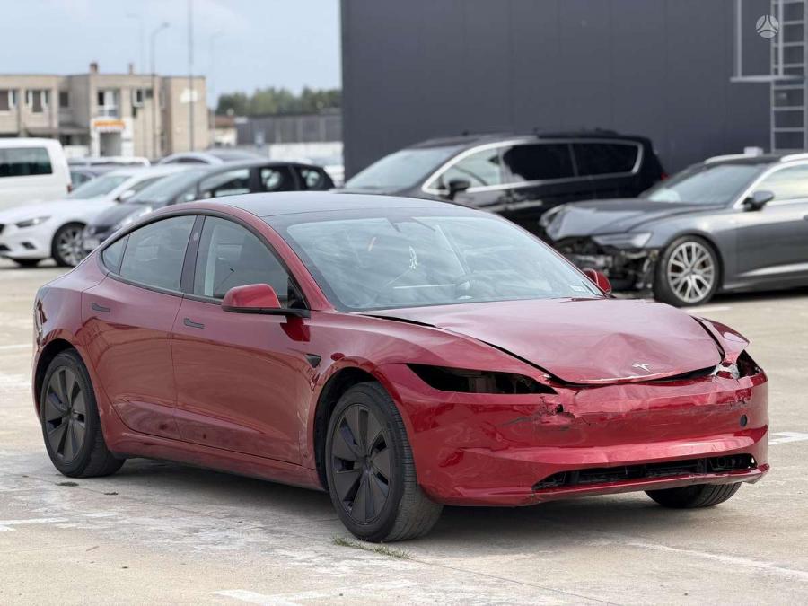 Red Tesla Model 3 2024 in Siauliai, with an engine capacity of 0.00 L and mileage of 33 thousand km for 18400 €, photo 1 on AUTOMOTO.COM.LV