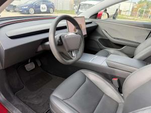 Red Tesla Model 3 2024 in Siauliai, with an engine capacity of 0.00 L and mileage of 33 thousand km for 18400 €, photo 8 on AUTOMOTO.COM.LV