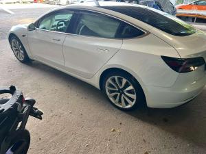 White Tesla Model 3 2020 in Marijampole, with an engine capacity of 0.00 L and mileage of 73 thousand km for 12200 €, photo 4 on AUTOMOTO.COM.LV