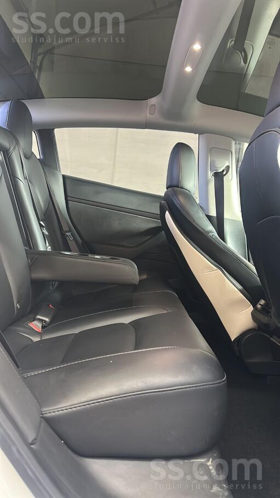 White Tesla Model 3 2021 in Riga, with an engine capacity of 0.00 L and mileage of 75 thousand km for 23800 €, photo 3 on AUTOMOTO.COM.LV