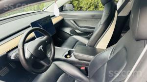 White Tesla Model 3 2021 in Riga, with an engine capacity of 0.00 L and mileage of 75 thousand km for 23800 €, photo 4 on AUTOMOTO.COM.LV