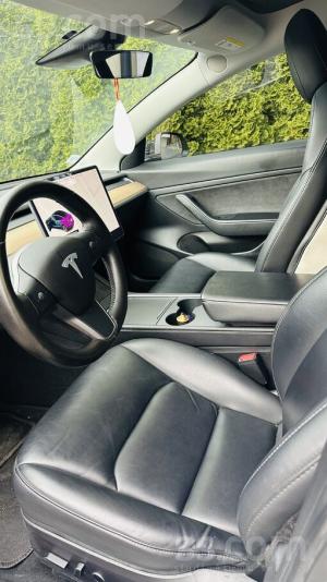 White Tesla Model 3 2021 in Riga, with an engine capacity of 0.00 L and mileage of 75 thousand km for 23800 €, photo 7 on AUTOMOTO.COM.LV
