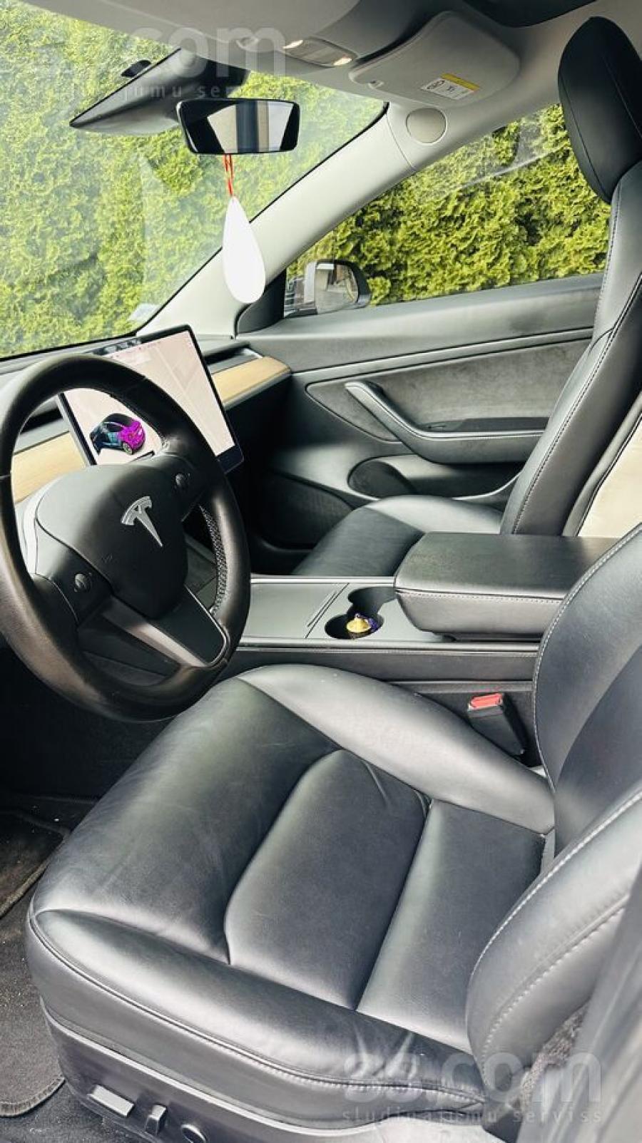 White Tesla Model 3 2021 in Riga, with an engine capacity of 0.00 L and mileage of 75 thousand km for 23800 €, photo 7 on AUTOMOTO.COM.LV