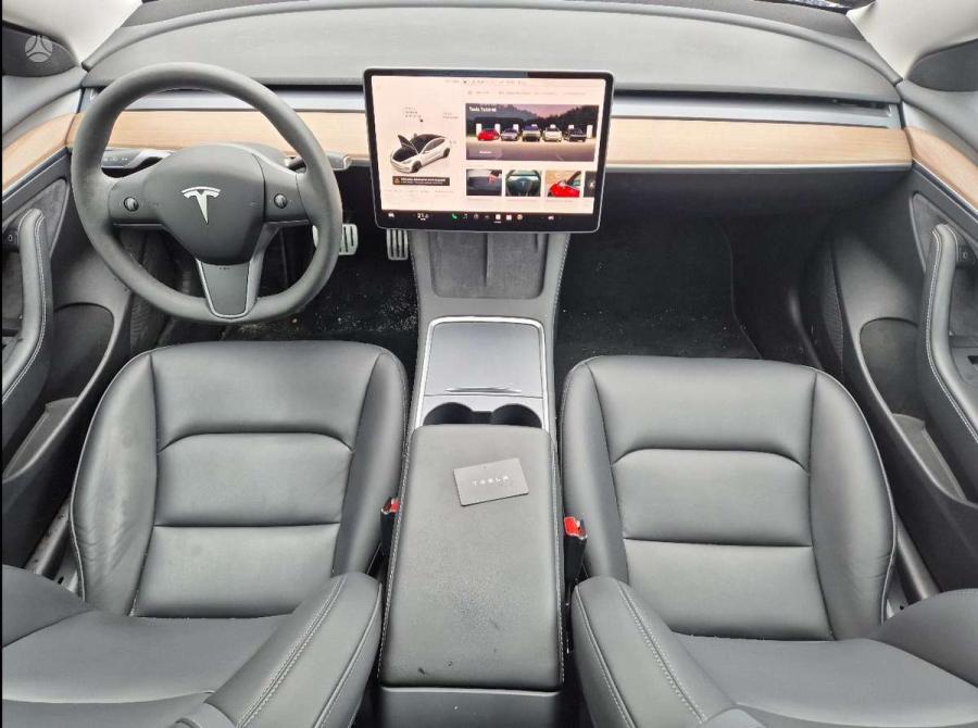 White Tesla Model 3 2023 in Klaipeda, with an engine capacity of 0.00 L and mileage of 63 thousand km for 11500 €, photo 6 on AUTOMOTO.COM.LV