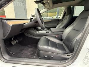 White Tesla Model 3 2023 in Riga, with an engine capacity of 0.00 L and mileage of 60 thousand km for 28900 €, photo 11 on AUTOMOTO.COM.LV