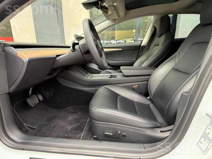 White Tesla Model 3 2023 in Riga, with an engine capacity of 0.00 L and mileage of 60 thousand km for 28900 €, photo 11 on AUTOMOTO.COM.LV