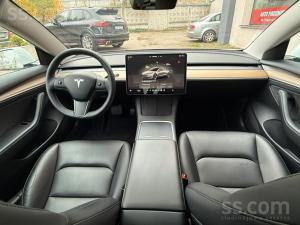 White Tesla Model 3 2023 in Riga, with an engine capacity of 0.00 L and mileage of 60 thousand km for 28900 €, photo 19 on AUTOMOTO.COM.LV