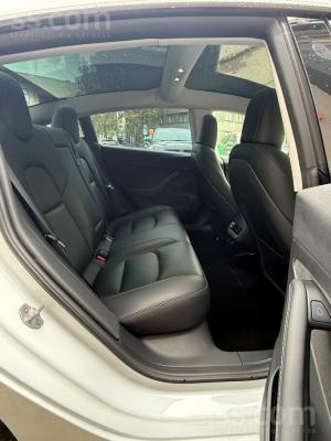 White Tesla Model 3 2023 in Riga, with an engine capacity of 0.00 L and mileage of 60 thousand km for 28900 €, photo 22 on AUTOMOTO.COM.LV