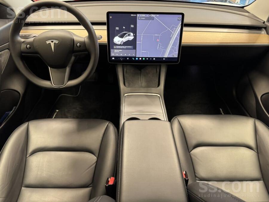 White Tesla Model 3 2021 in Riga, with an engine capacity of 0.00 L and mileage of 115 thousand km for 24990 €, photo 12 on AUTOMOTO.COM.LV