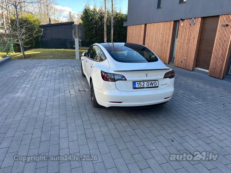 White Tesla Model 3 2021 in Tallinn, with an engine capacity of 0.00 L and mileage of 87 thousand km for 29000 €, photo 5 on AUTOMOTO.COM.LV