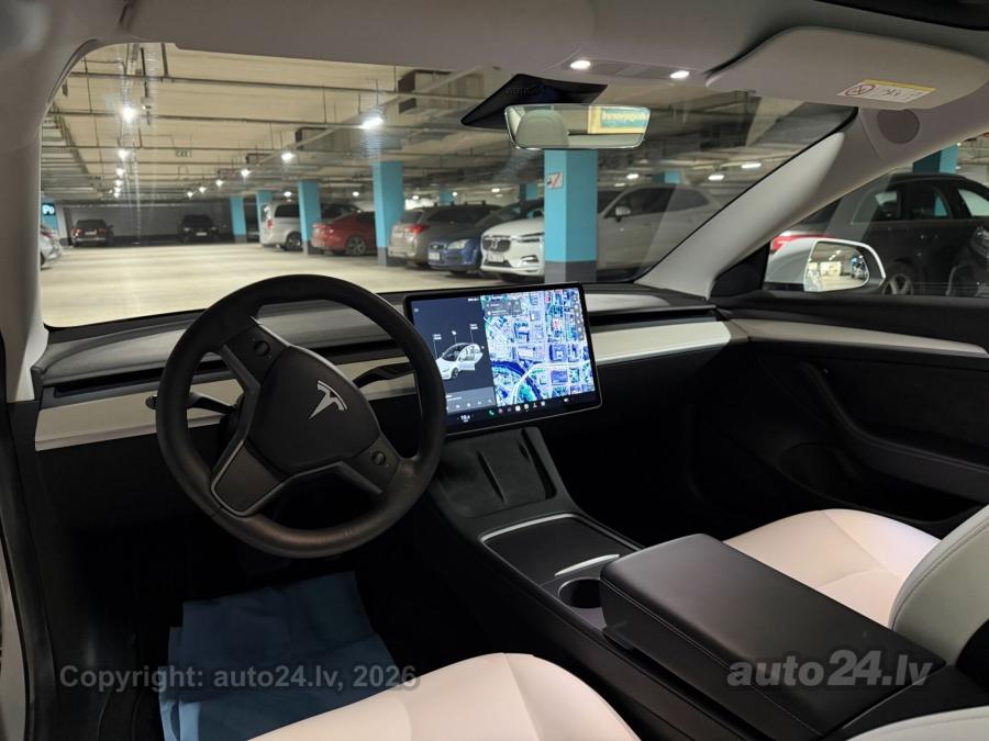 White Tesla Model 3 2021 in Tallinn, with an engine capacity of 0.00 L and mileage of 83 thousand km for 28490 €, photo 5 on AUTOMOTO.COM.LV