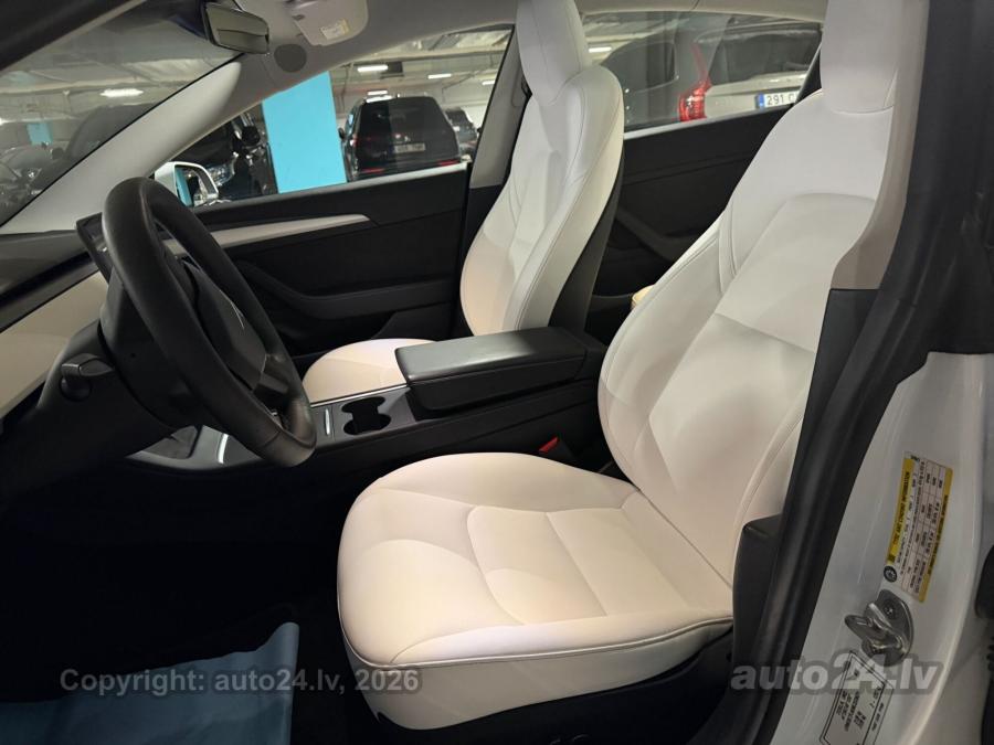 White Tesla Model 3 2021 in Tallinn, with an engine capacity of 0.00 L and mileage of 83 thousand km for 28490 €, photo 6 on AUTOMOTO.COM.LV