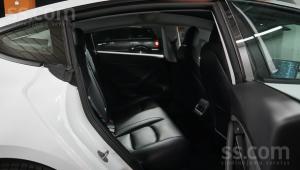 White Tesla Model 3 2021 in Riga, with an engine capacity of 0.00 L and mileage of 63 thousand km for 24500 €, photo 9 on AUTOMOTO.COM.LV