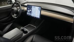 White Tesla Model 3 2021 in Riga, with an engine capacity of 0.00 L and mileage of 63 thousand km for 24500 €, photo 11 on AUTOMOTO.COM.LV