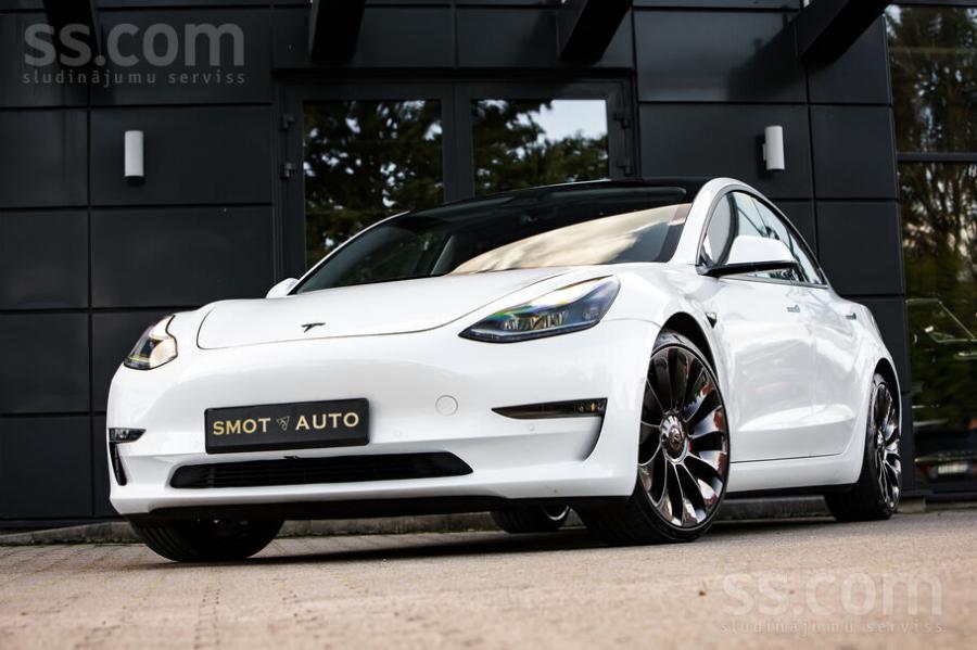 White Tesla Model 3 2021 in Riga, with an engine capacity of 0.00 L and mileage of 82 thousand km for 28500 €, photo 1 on AUTOMOTO.COM.LV