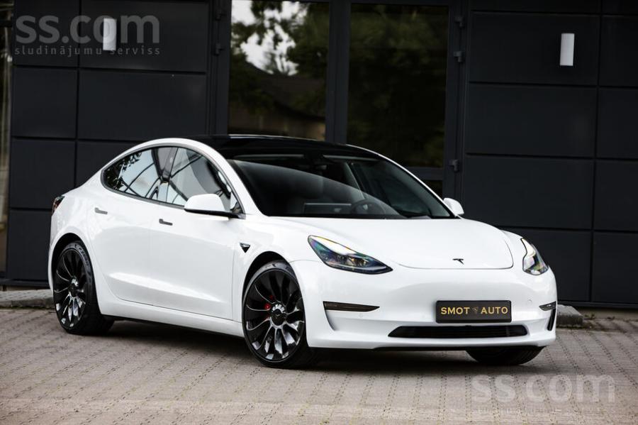 White Tesla Model 3 2021 in Riga, with an engine capacity of 0.00 L and mileage of 82 thousand km for 28500 €, photo 6 on AUTOMOTO.COM.LV