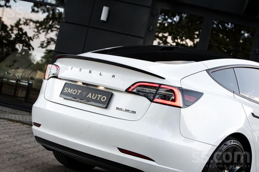 White Tesla Model 3 2021 in Riga, with an engine capacity of 0.00 L and mileage of 82 thousand km for 28500 €, photo 7 on AUTOMOTO.COM.LV