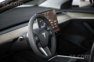 White Tesla Model 3 2021 in Riga, with an engine capacity of 0.00 L and mileage of 82 thousand km for 28500 €, photo 14 on AUTOMOTO.COM.LV