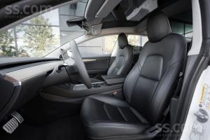 White Tesla Model 3 2021 in Riga, with an engine capacity of 0.00 L and mileage of 82 thousand km for 28500 €, photo 15 on AUTOMOTO.COM.LV
