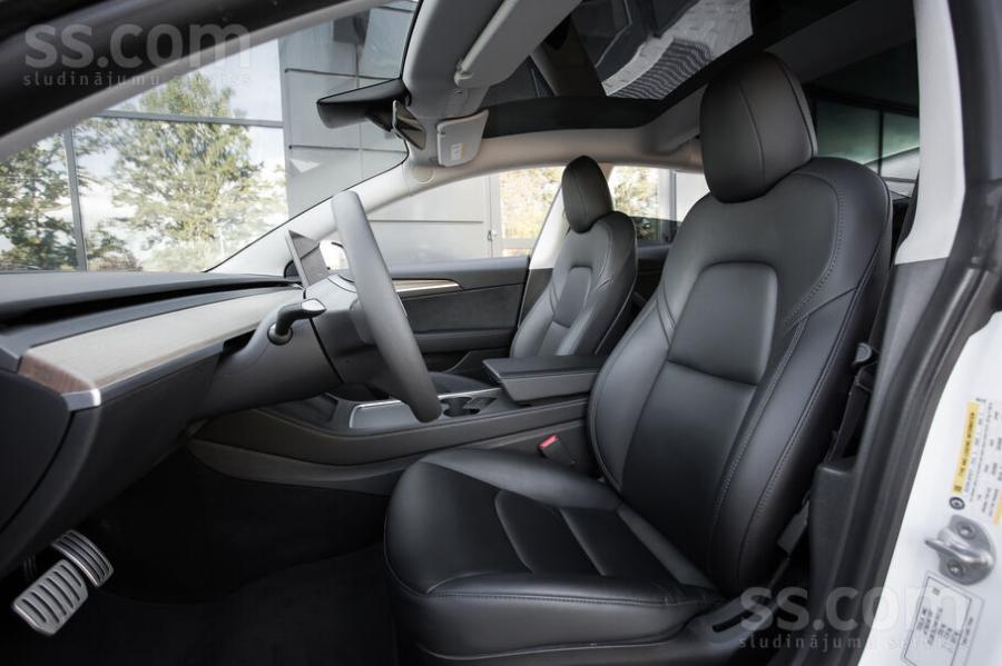 White Tesla Model 3 2021 in Riga, with an engine capacity of 0.00 L and mileage of 82 thousand km for 28500 €, photo 15 on AUTOMOTO.COM.LV
