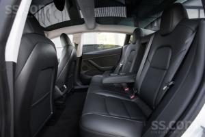 White Tesla Model 3 2021 in Riga, with an engine capacity of 0.00 L and mileage of 82 thousand km for 28500 €, photo 17 on AUTOMOTO.COM.LV