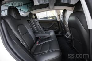 White Tesla Model 3 2021 in Riga, with an engine capacity of 0.00 L and mileage of 82 thousand km for 28500 €, photo 19 on AUTOMOTO.COM.LV