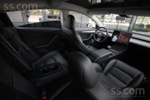 White Tesla Model 3 2021 in Riga, with an engine capacity of 0.00 L and mileage of 82 thousand km for 28500 €, photo 20 on AUTOMOTO.COM.LV