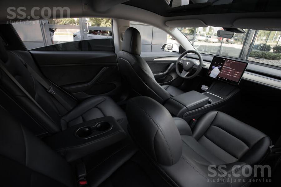 White Tesla Model 3 2021 in Riga, with an engine capacity of 0.00 L and mileage of 82 thousand km for 28500 €, photo 20 on AUTOMOTO.COM.LV