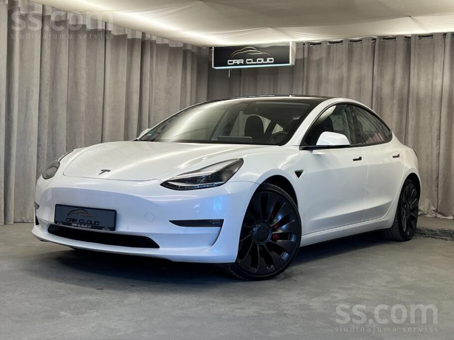 White Tesla Model 3 2021 in Riga, with an engine capacity of 0.00 L and mileage of 103 thousand km for 26990 €, photo 1 on AUTOMOTO.COM.LV