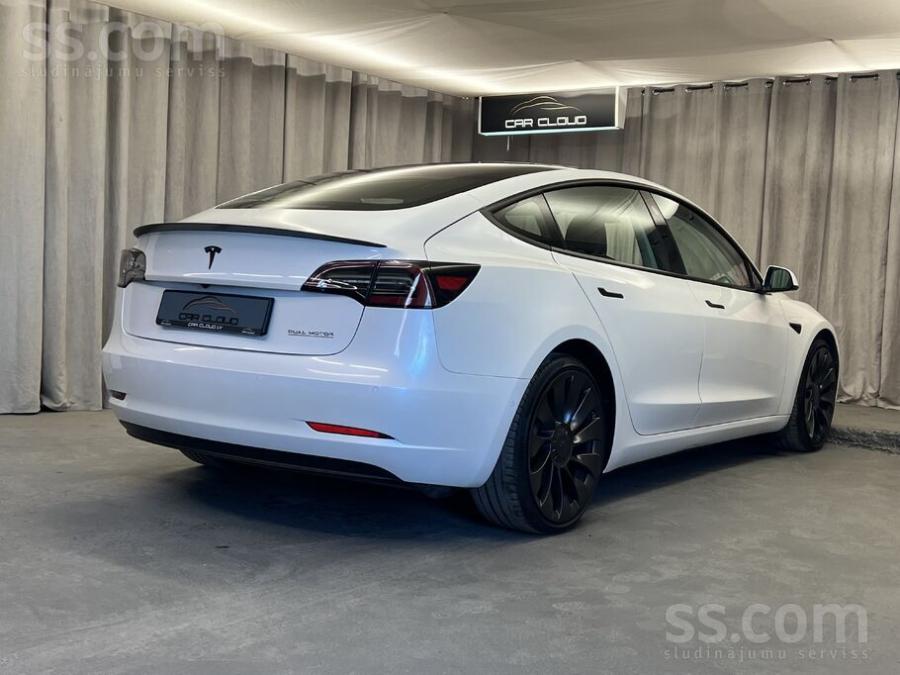 White Tesla Model 3 2021 in Riga, with an engine capacity of 0.00 L and mileage of 103 thousand km for 26990 €, photo 7 on AUTOMOTO.COM.LV