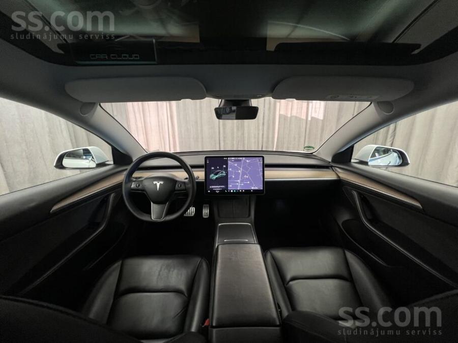 White Tesla Model 3 2021 in Riga, with an engine capacity of 0.00 L and mileage of 103 thousand km for 26990 €, photo 13 on AUTOMOTO.COM.LV